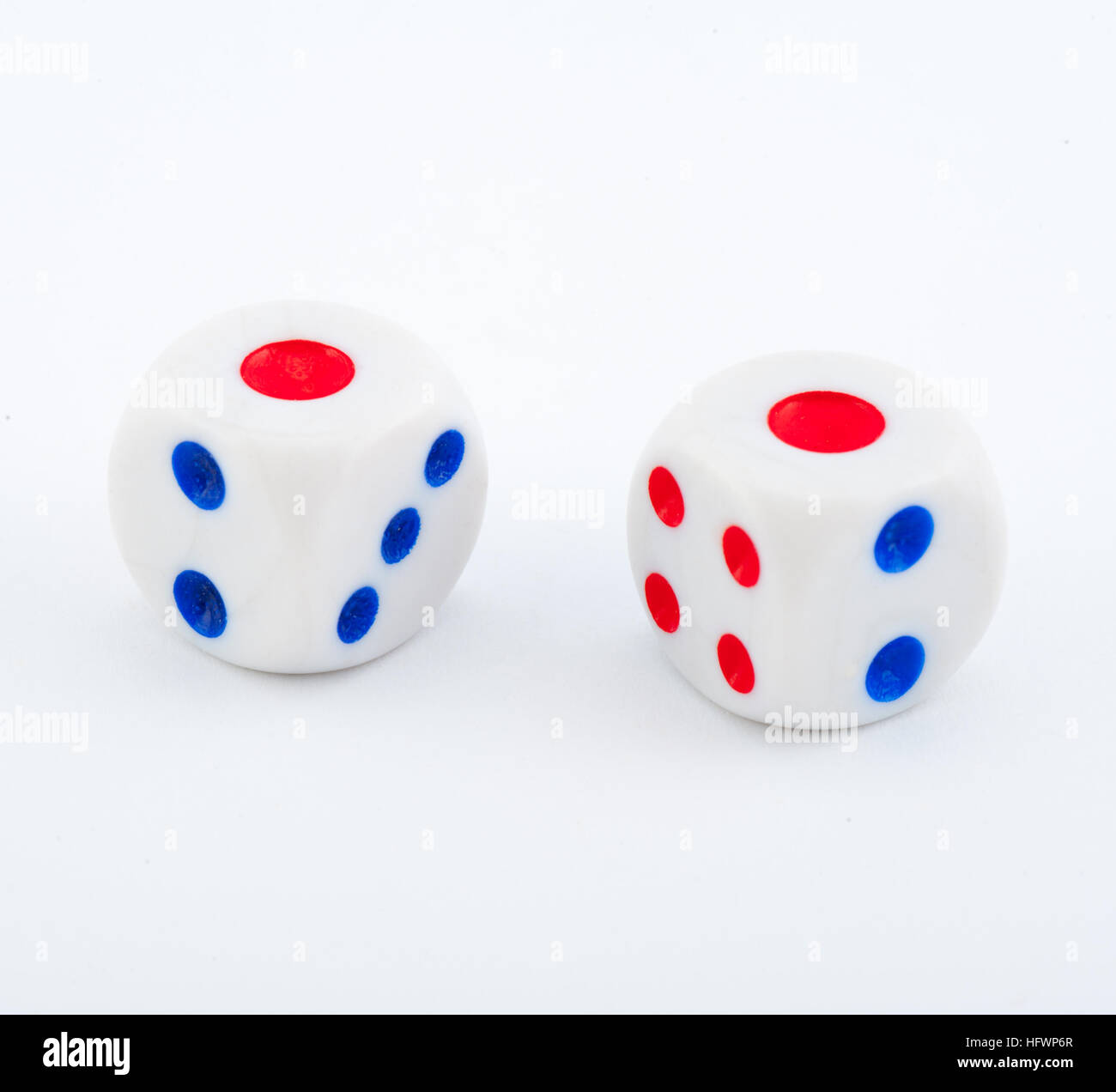dice with blue and red dots on a white background Stock Photo - Alamy