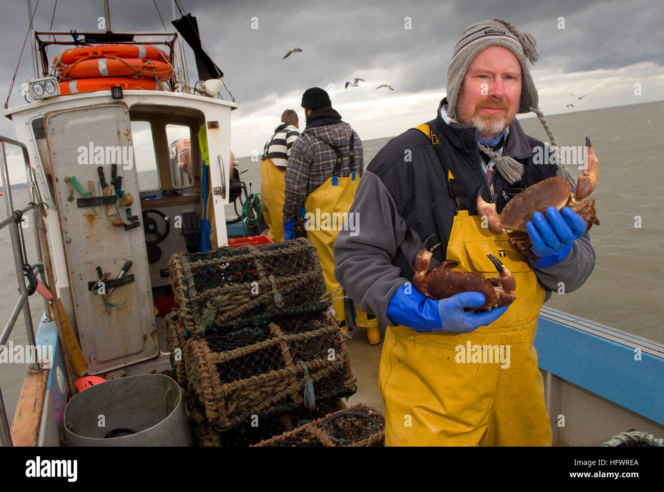 Crab fishing in Dorset with Les Lawrence (yellow wader) with fellow ...