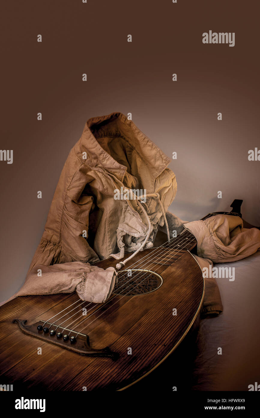 Oud Guitar Lute and white rustic baroque shirt In shape and posture of ...
