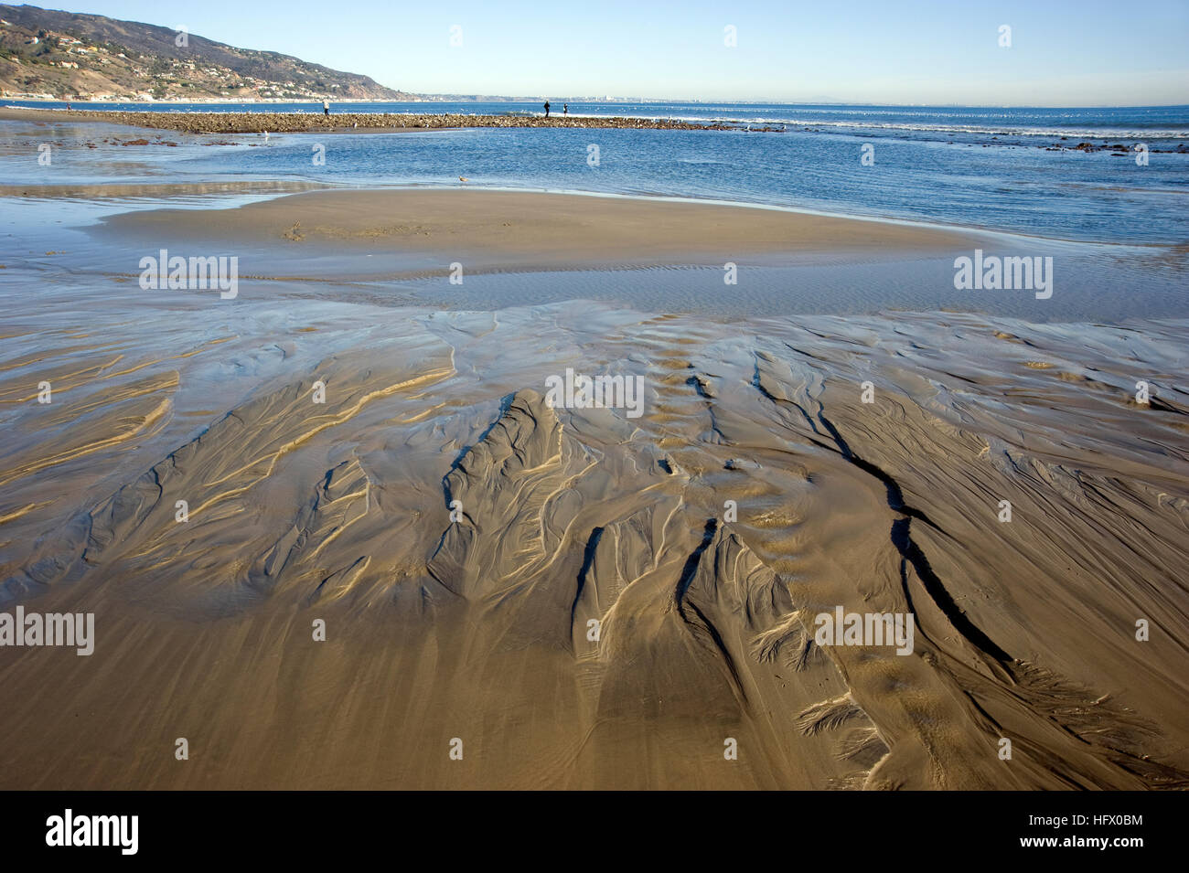 Patterns in the sand at low tide on Malibu Beach on the California ...