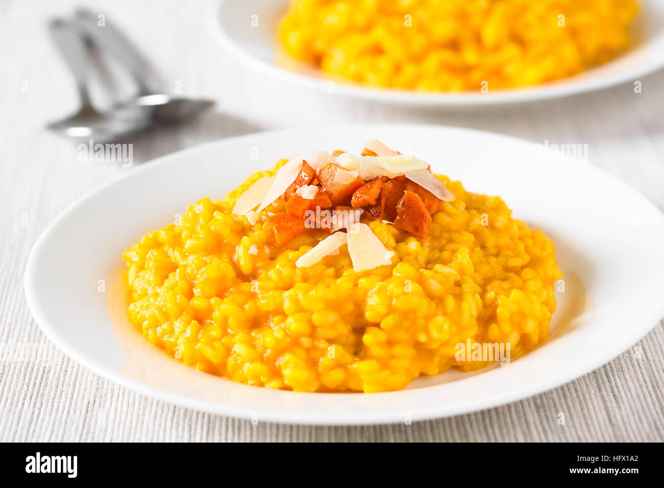 Fresh homemade carrot risotto made with pureed carrot, garnished with ...