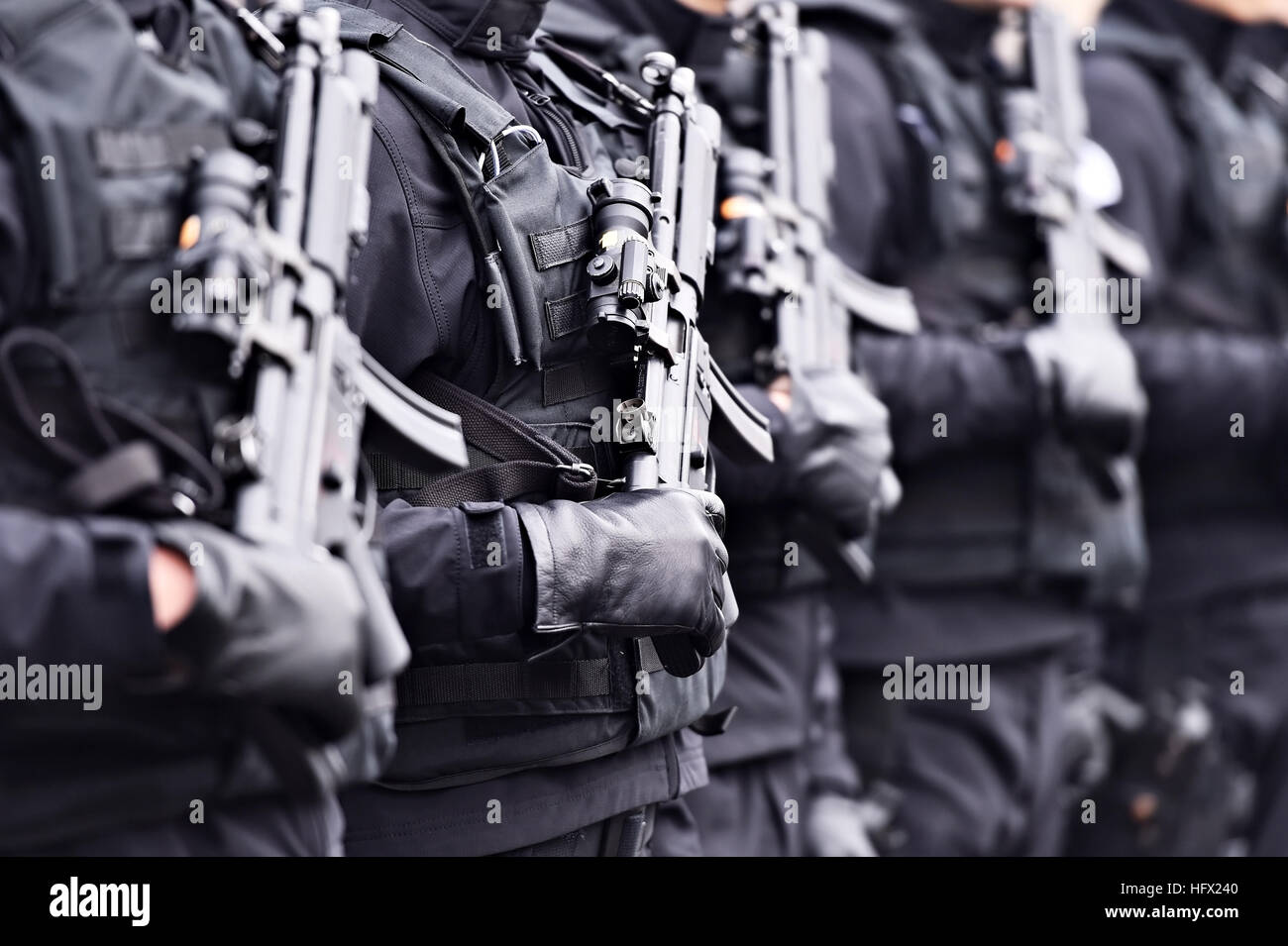Army soldier standing holding glove uniform in a row hi-res stock ...