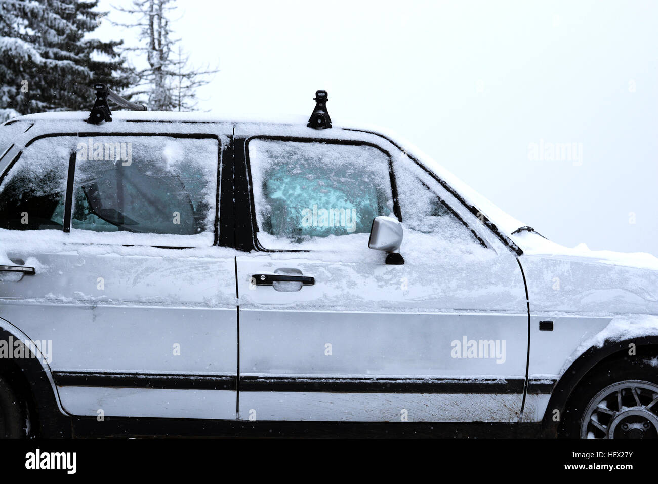 Old white car covered by snow in wintertime Stock Photo - Alamy