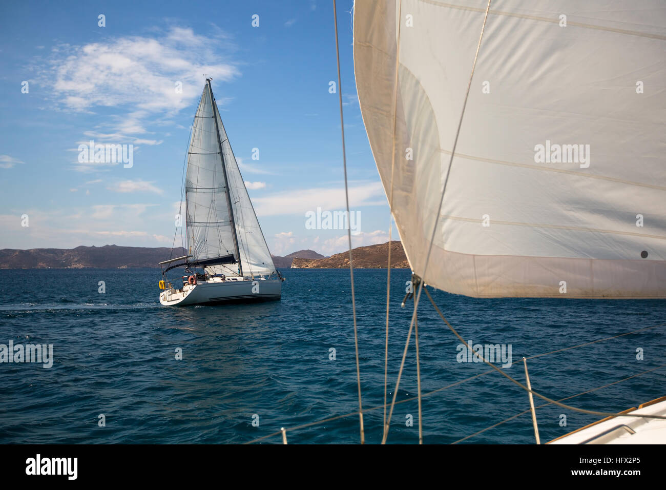 Boat competitor of sailing regatta in clear weather. Luxury yachts ...