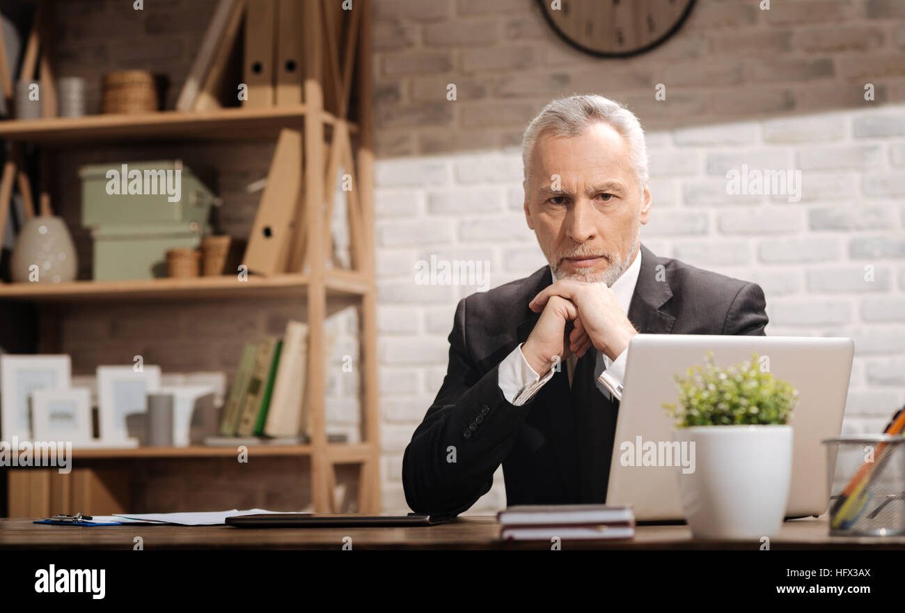 Concerned serious businessman thinking Stock Photo - Alamy