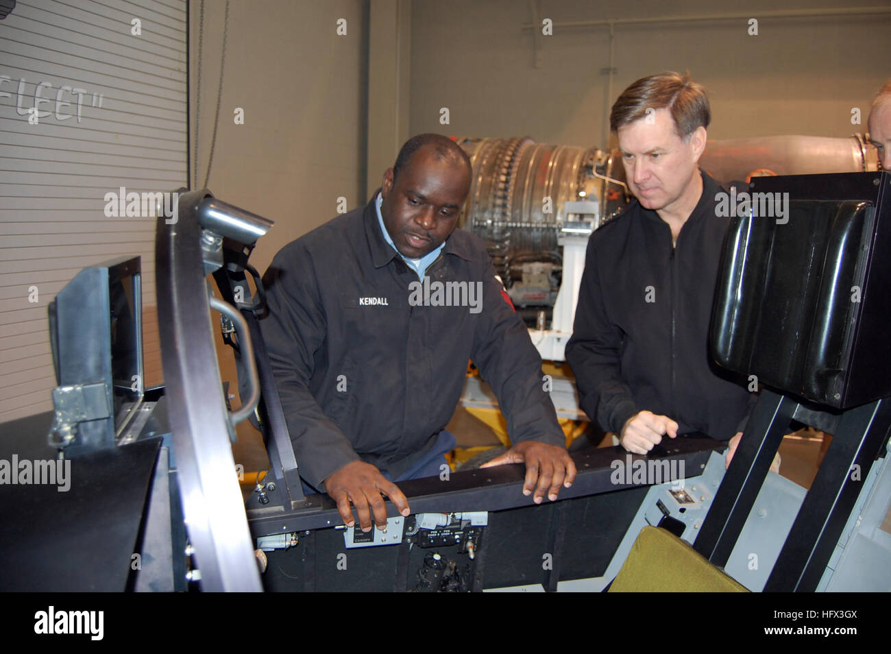 Instructor at CNATTU demonstrates F/A-18 mock-up cockpit for aviation ...