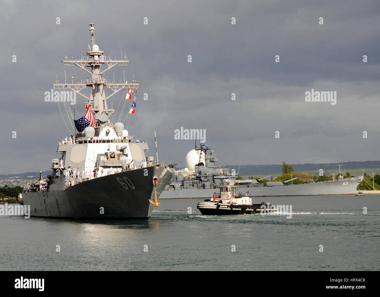 The guided-missile destroyer USS Paul Hamilton passes the Battleship ...
