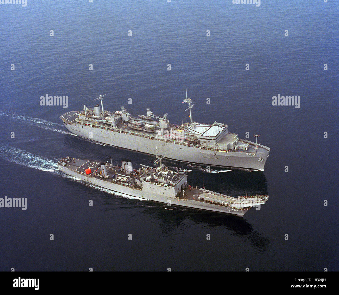 An elevated starboard bow view of the destroyer tender USS ACADIA (AD ...