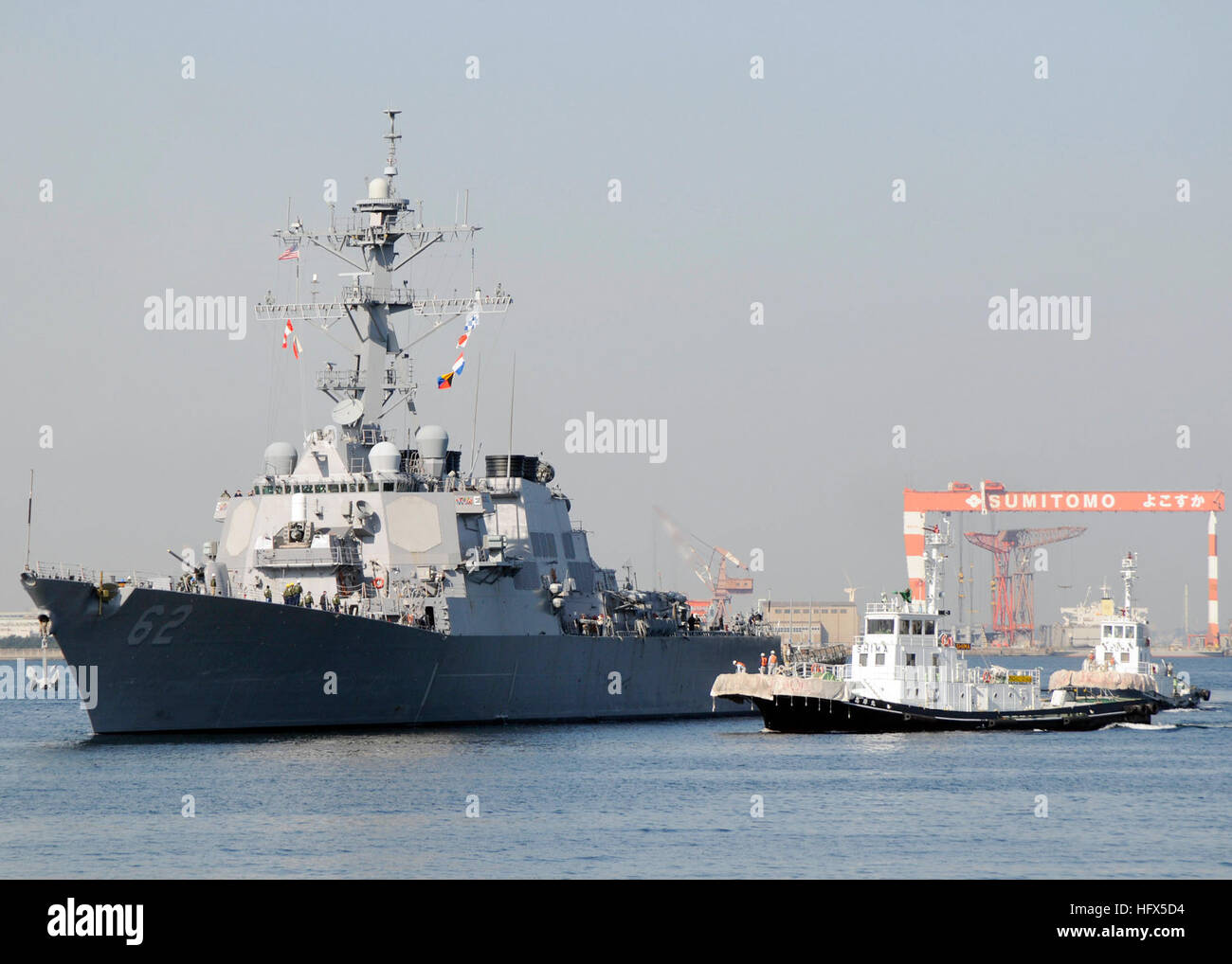 Tugboats Azuma and Shima guide the Arleigh Burke-class guided-missile ...