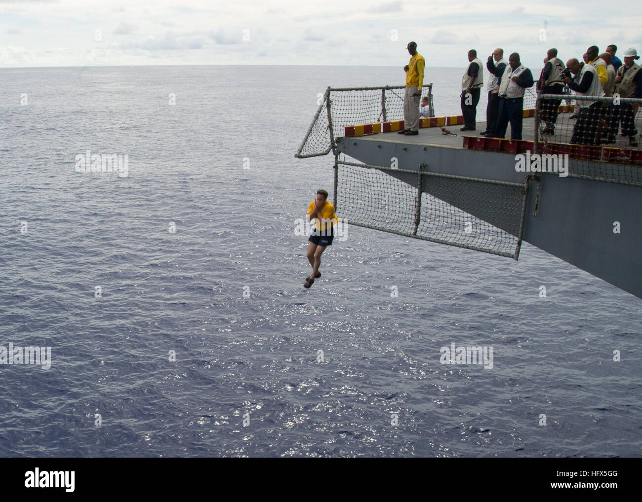 Sailors participate in a command swim call aboard the amphibious ...