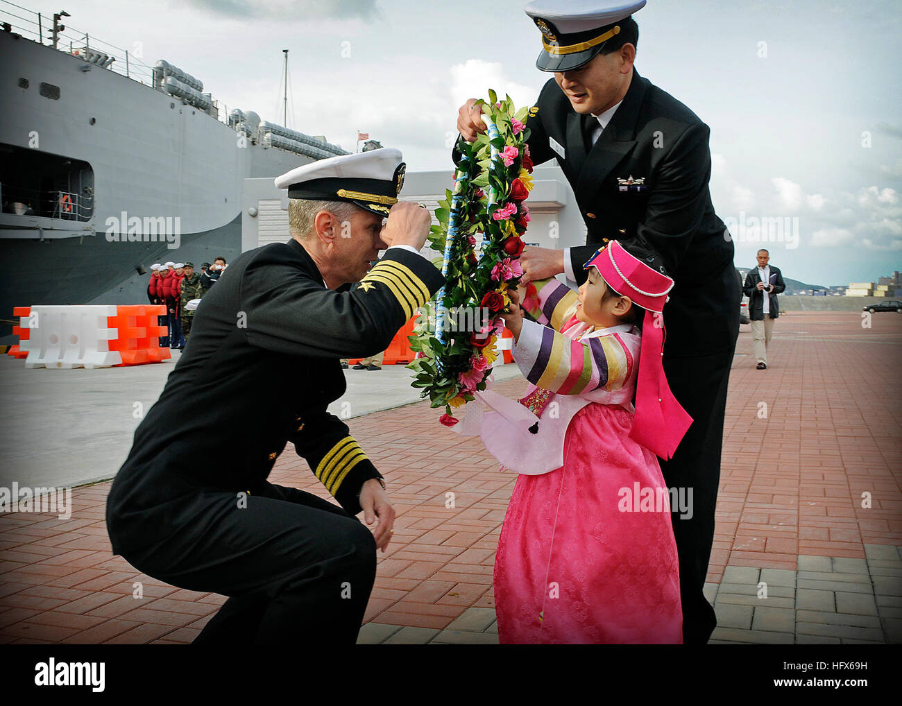 Capt. Thom W. Burke, left, commanding officer of the amphibious command ...