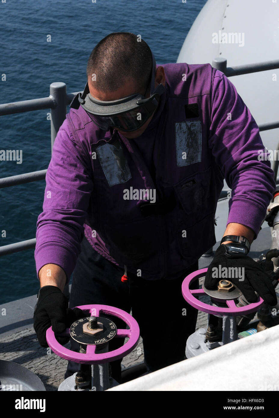 An Aviation Boatswain's Mate conducts fuel flushing aboard USS ...