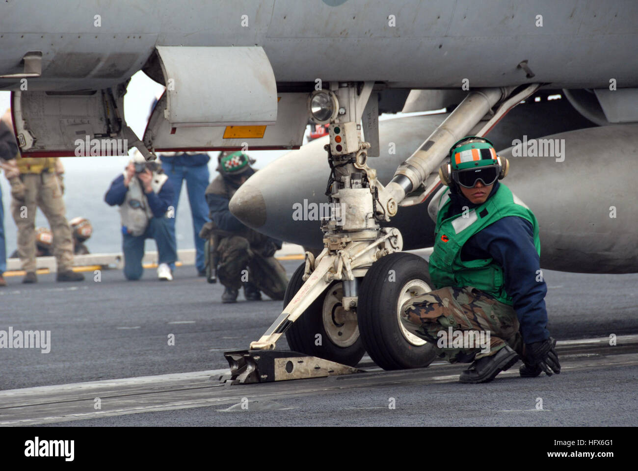 Petty Officer 2nd Class Jhade Bugauisan is the catapult safety watch on ...