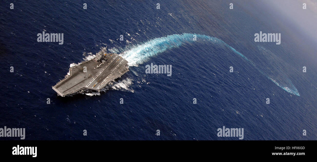 The aircraft carrier USS Harry S. Truman conducts high-speed turns ...
