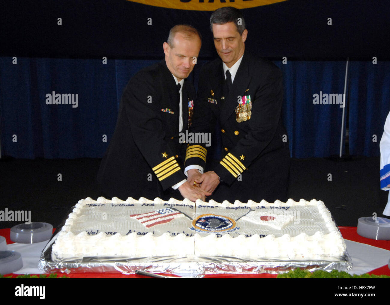 Capt. J. R. Haley, left, former commanding officer of the aircraft ...