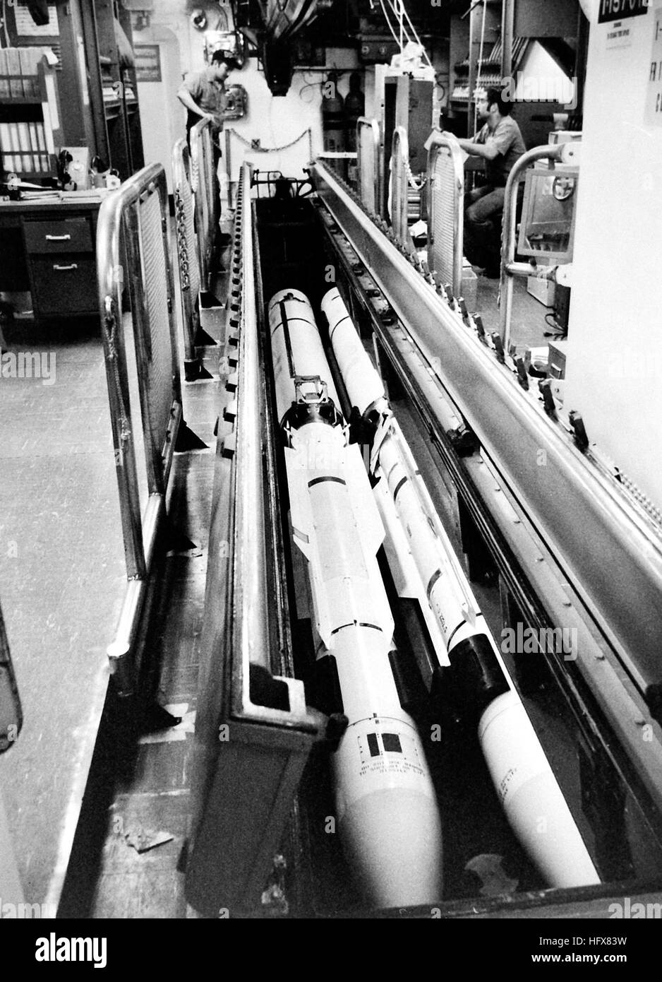 SM-2 (ER) missiled are loaded on the missile house rail aboard the ...