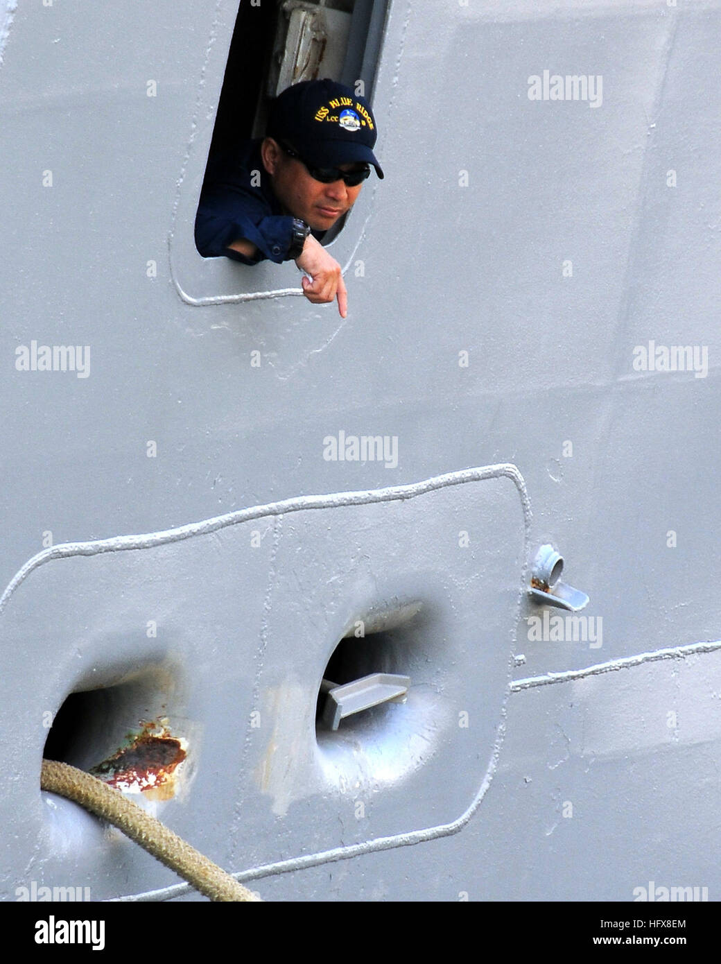 A Sailor assigned to the amphibious command ship USS Blue Ridge looks ...