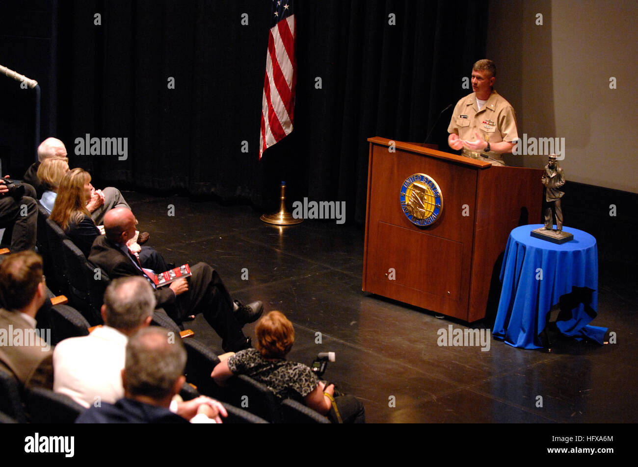 The Master Chief Petty Officer of the Navy addresses guests at a book ...