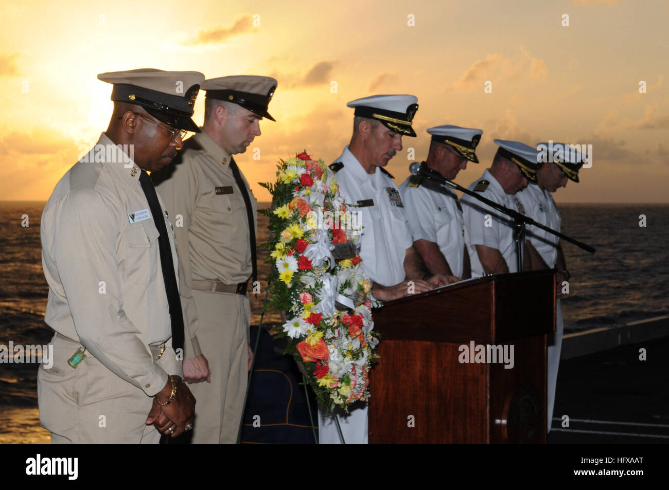 The leadership of the Ronald Reagan strike group bow their heads during ...