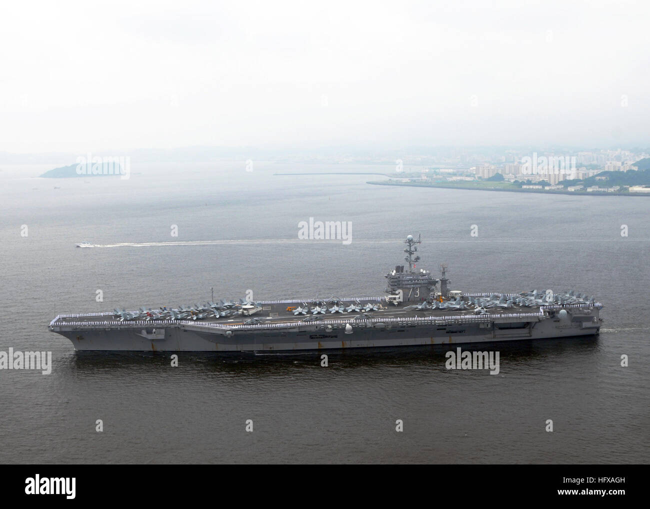 090610-N-9565D-086 YOKOSUKA, Japan (June 10, 2009) Sailors man the ...