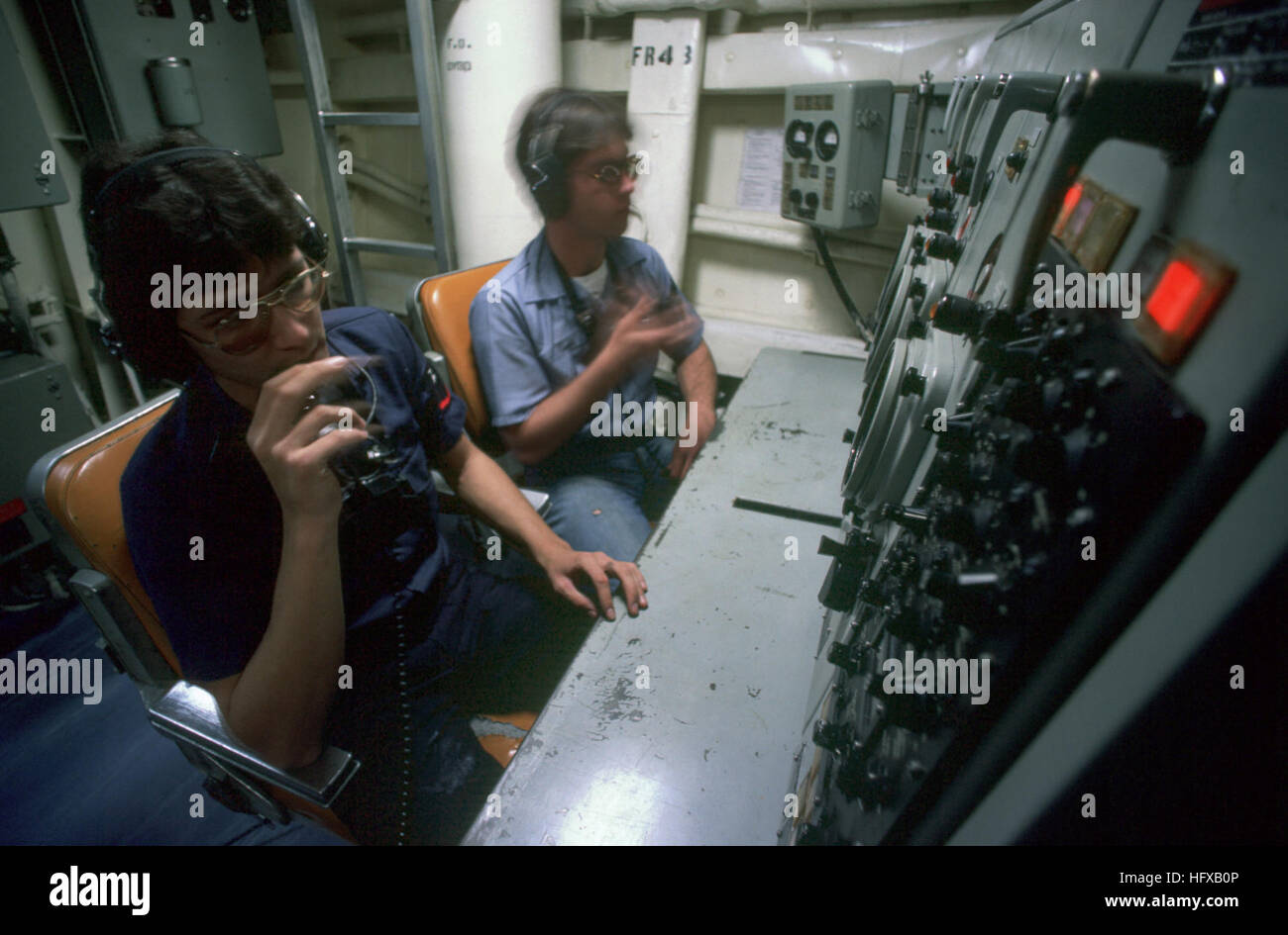Crewmen man their stations in the fire control center aboard the Knox ...
