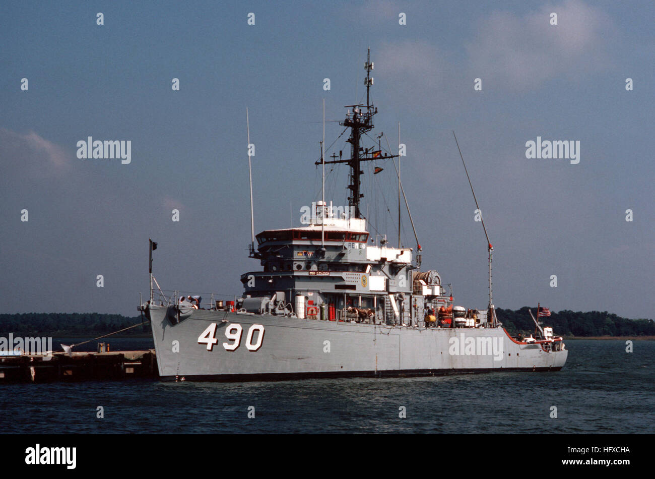 A port bow view of the ocean minesweeper USS LEADER (MSO 490) docked at ...