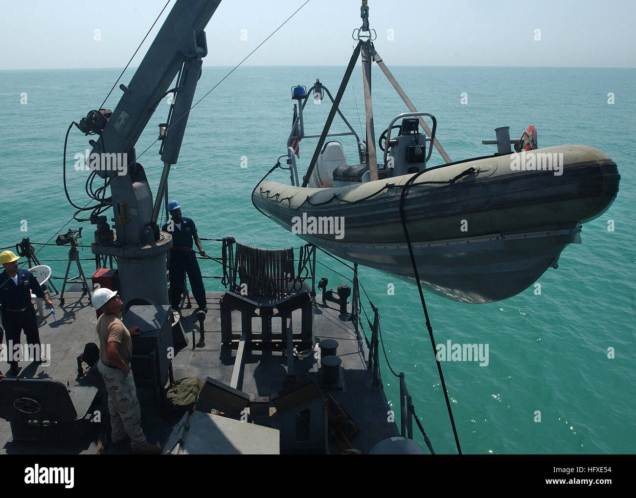 Sailors aboard the coastal patrol boat USS Firebolt (PC 10) deploy a ...