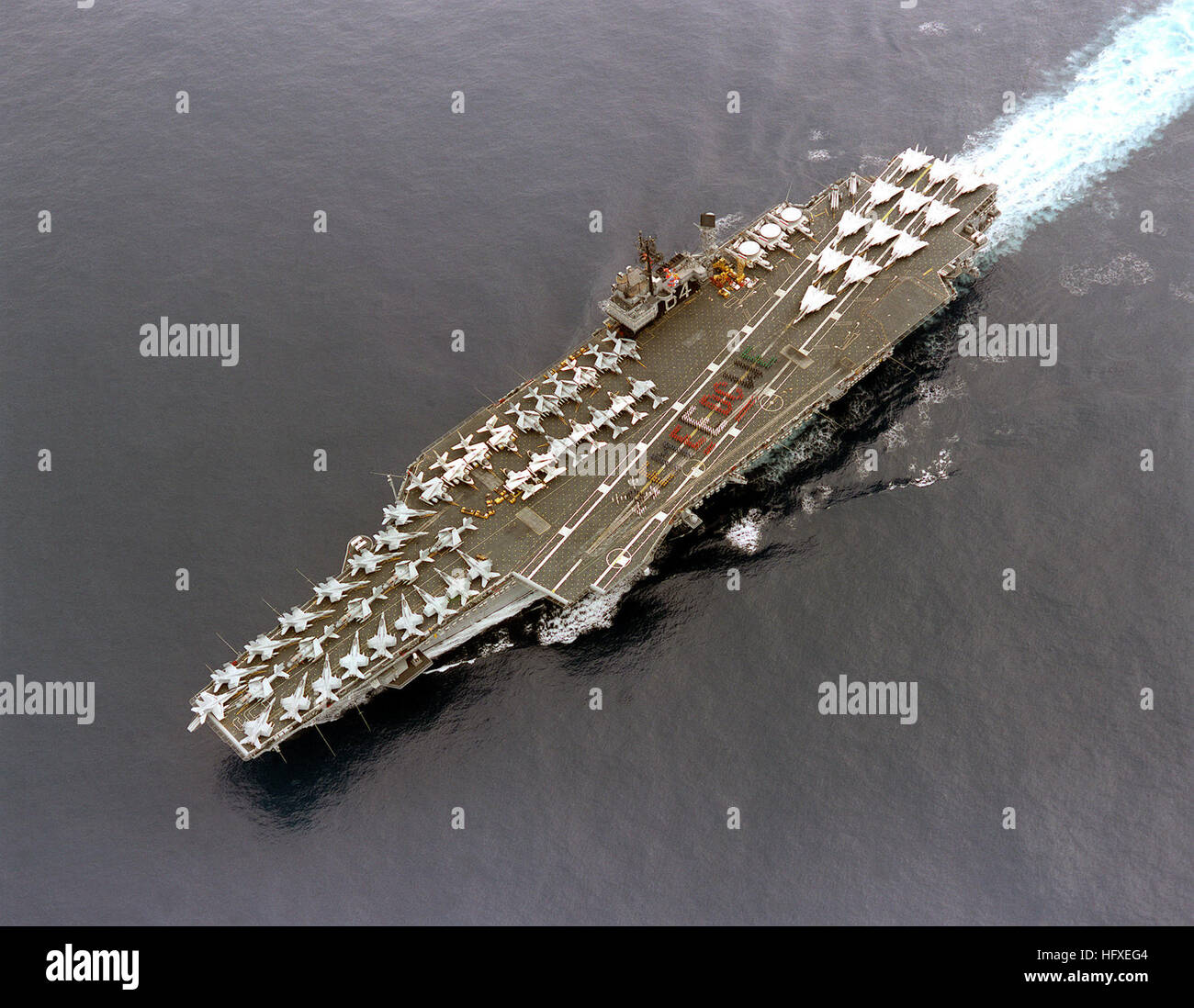 An aerial port beam view of the aircraft carrier USS CONSTELLATION (CV ...