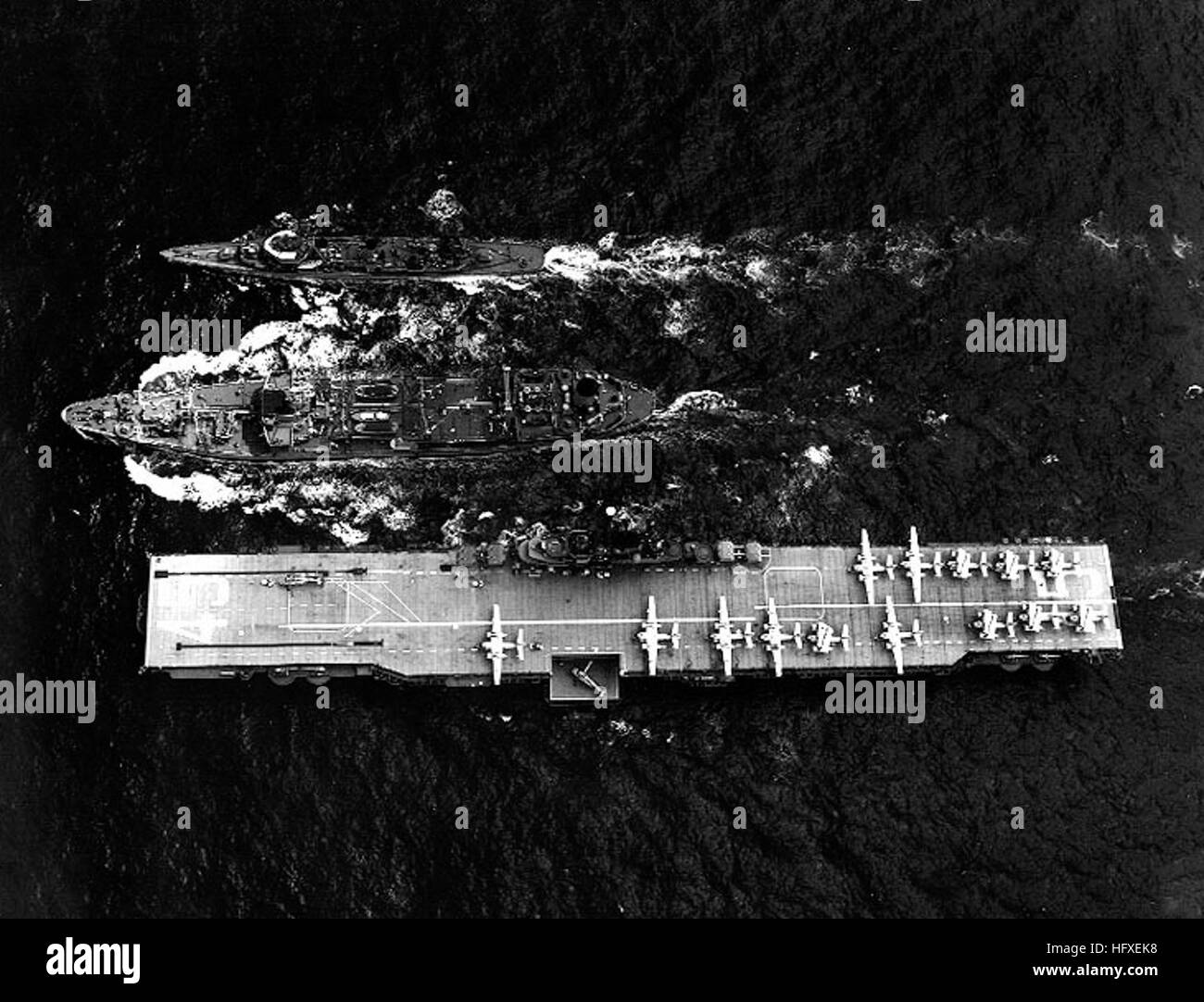 USS Pawcatuck (AO-108) refueling USS Valley Forge (CVS-45) and USS ...