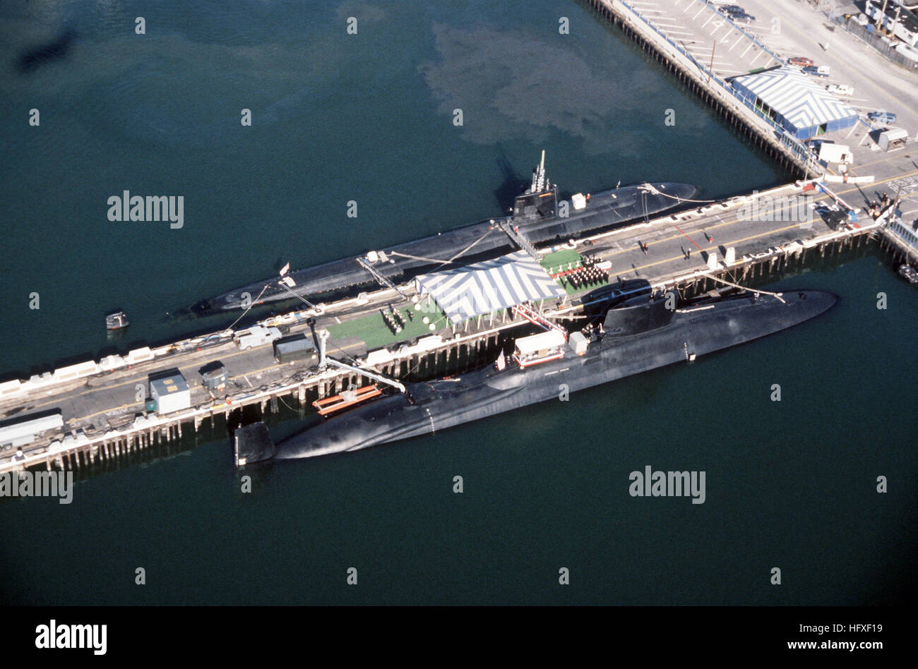 An elevated view of the nuclear-powered attack submarine USS BALTIMORE (SSN 704) and the nuclear ...