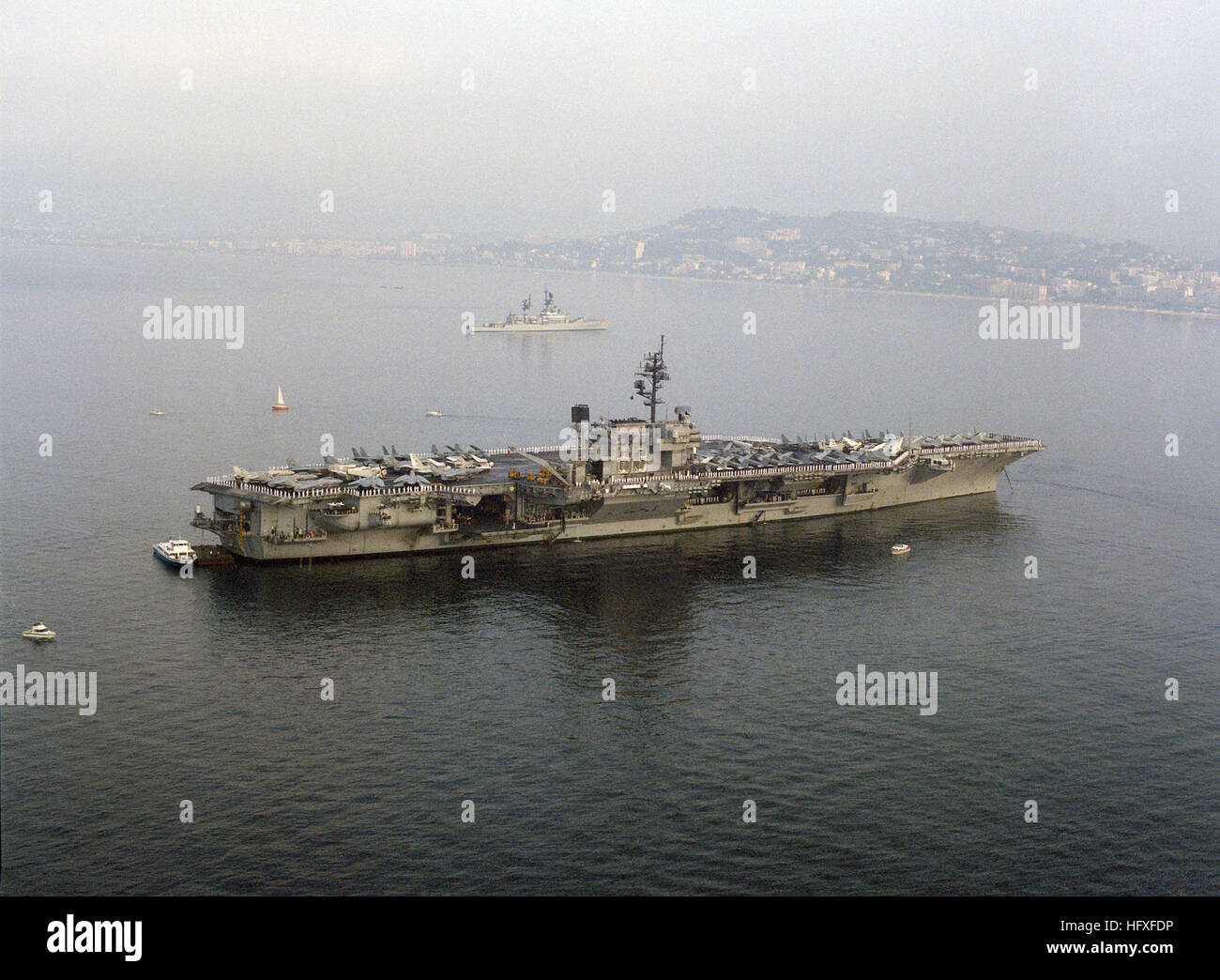 An aerial starboard quarter view of the aircraft carrier USS KITTY HAWK ...