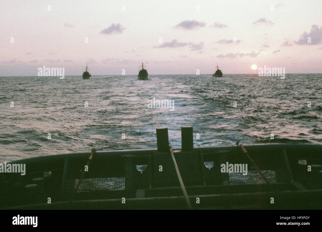 The salvage ship USS GRAPPLE (ARS 53) tows the ocean minesweepers USS ...