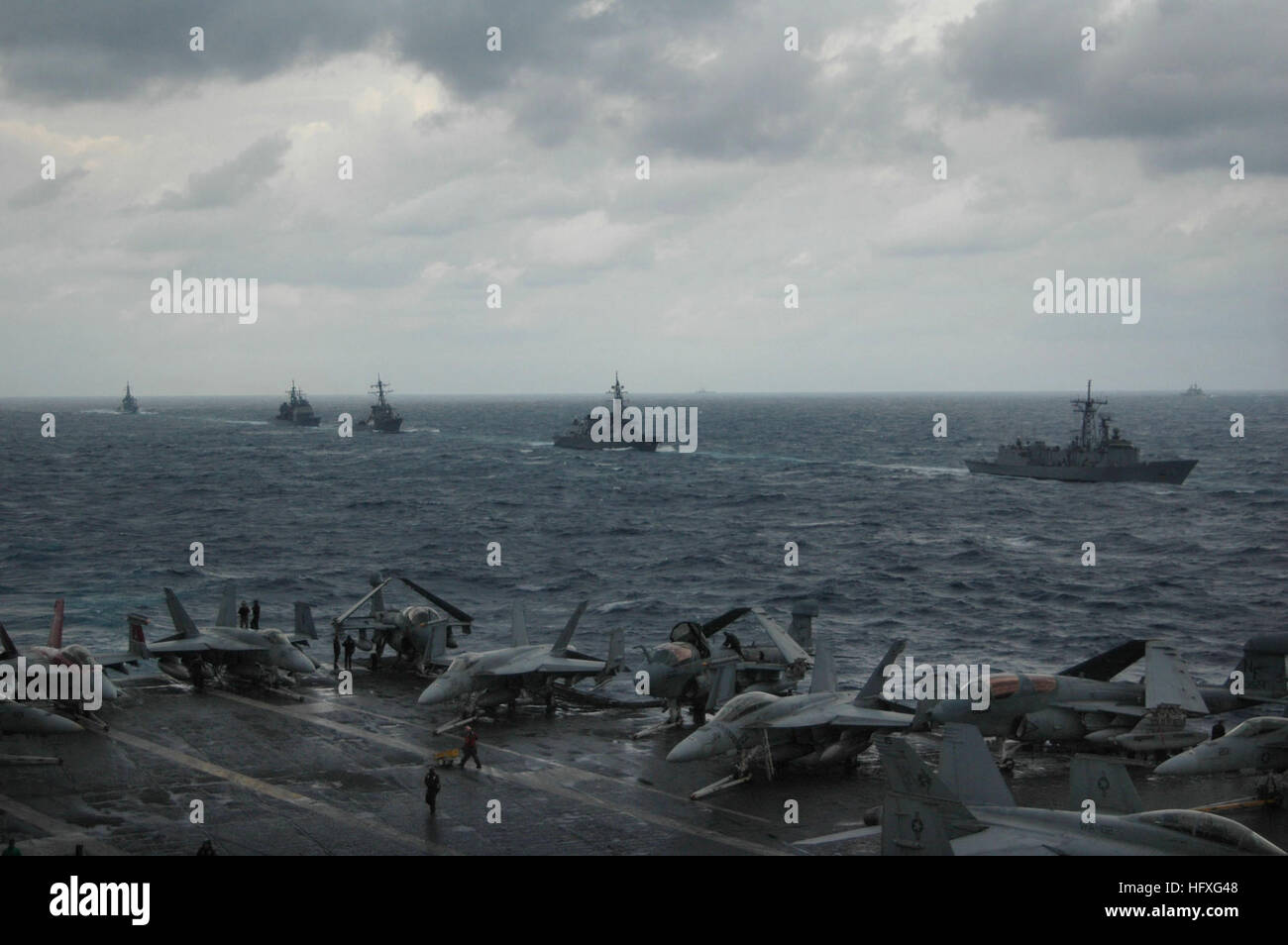 U.S. Navy and JMSDF ships operate in formation near USS Kitty Hawk (CV ...
