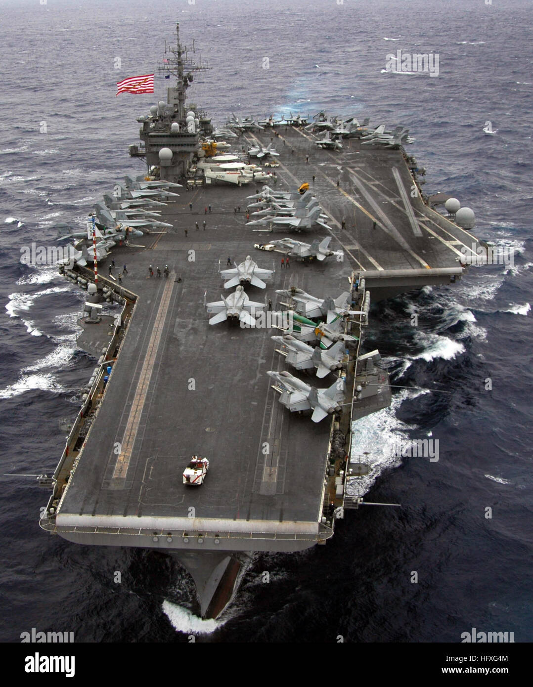 USS Kitty Hawk (CV 63) conducts flight operations following a formation ...