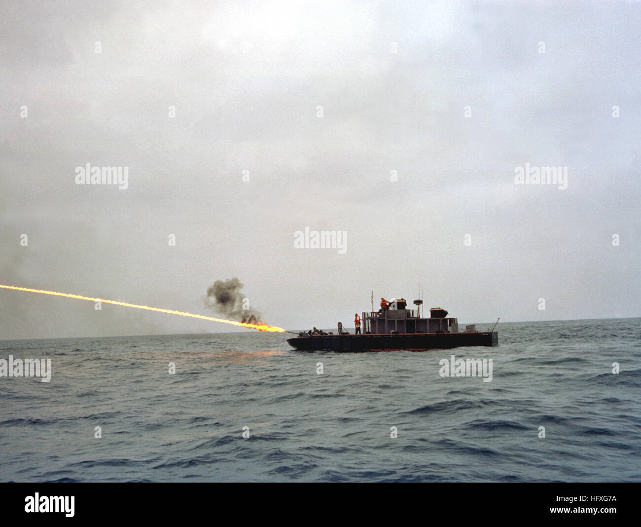 A U. S. Navy ZIPPO flame thrower is test fired from a patrol boat. US ...