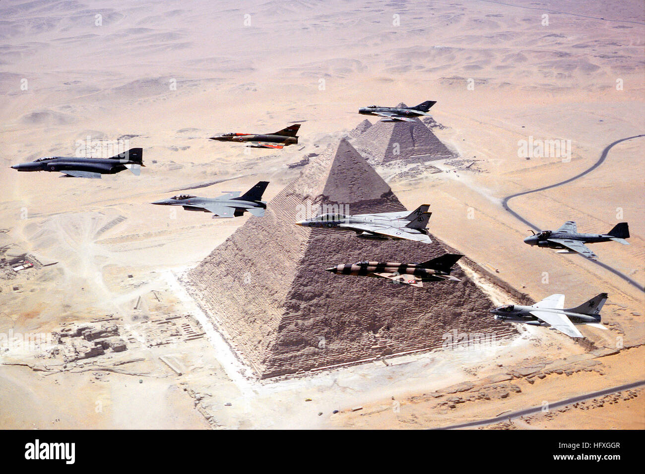 A formation of Egyptian and U.S. Navy aircraft fly over one of the ...