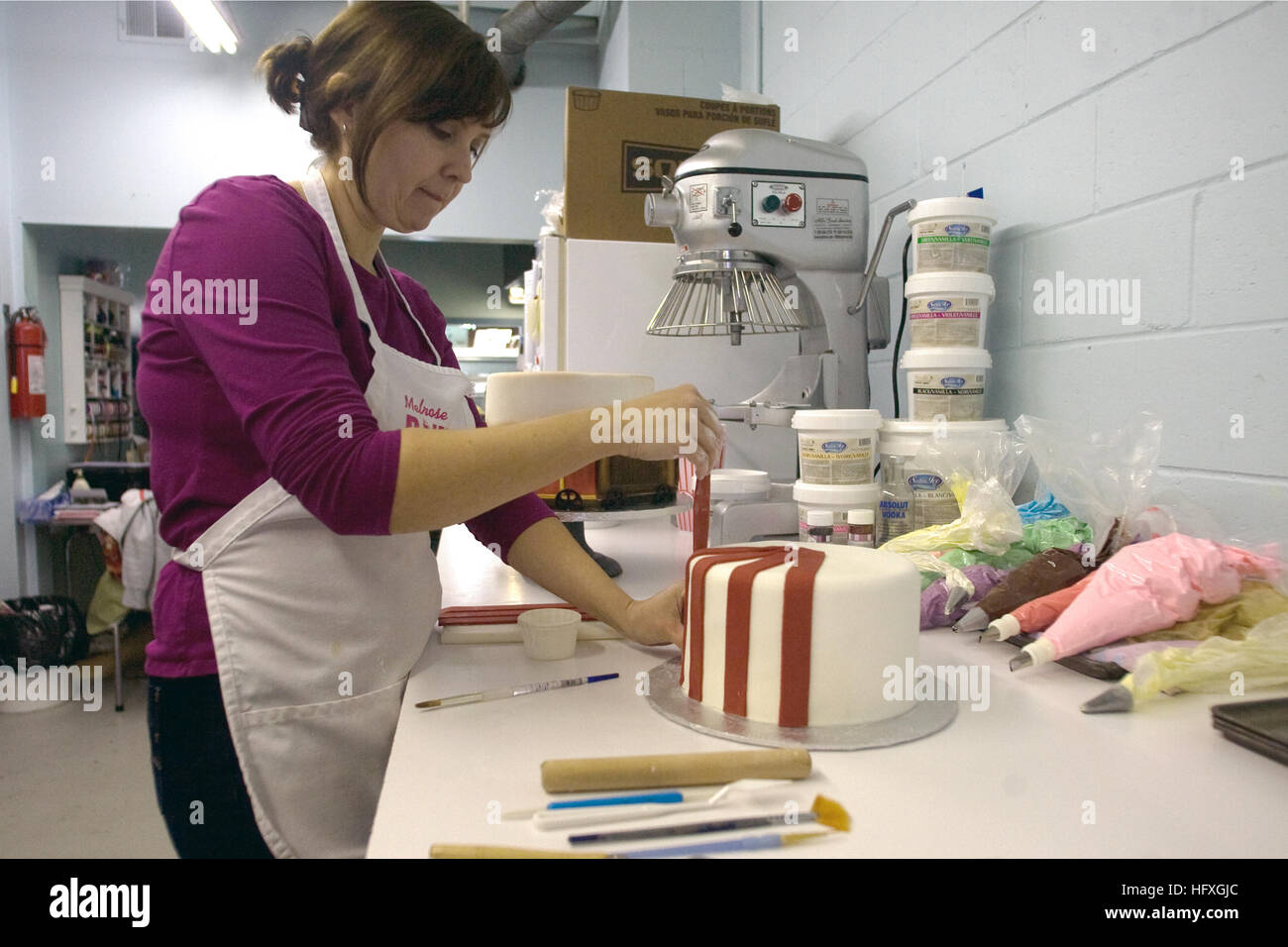 Amy Cheetham, of Melrose Bakery in London, Canada, carefully places the ...