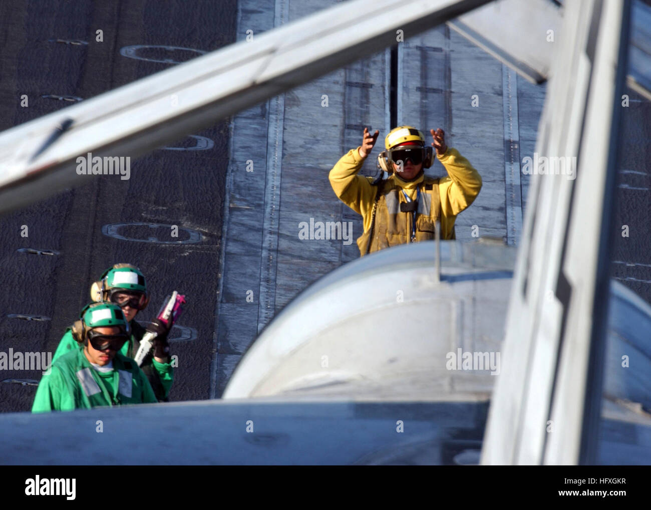 051202-N-0685C-002 Persian Gulf (Dec. 2, 2005) - An aircraft director ...
