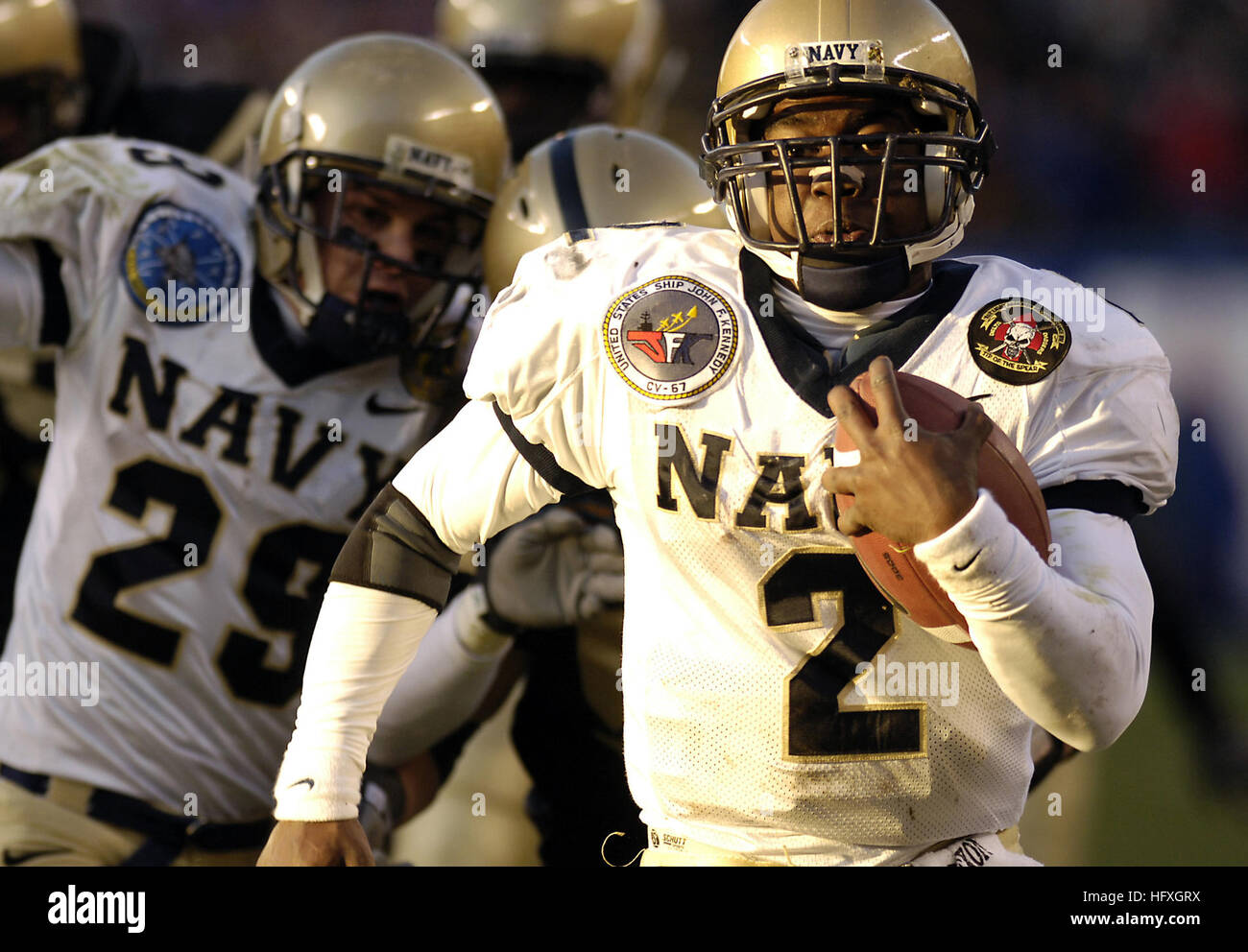 Navy quarterback Lamar Owens runs for a touchdown during the Army Navy ...