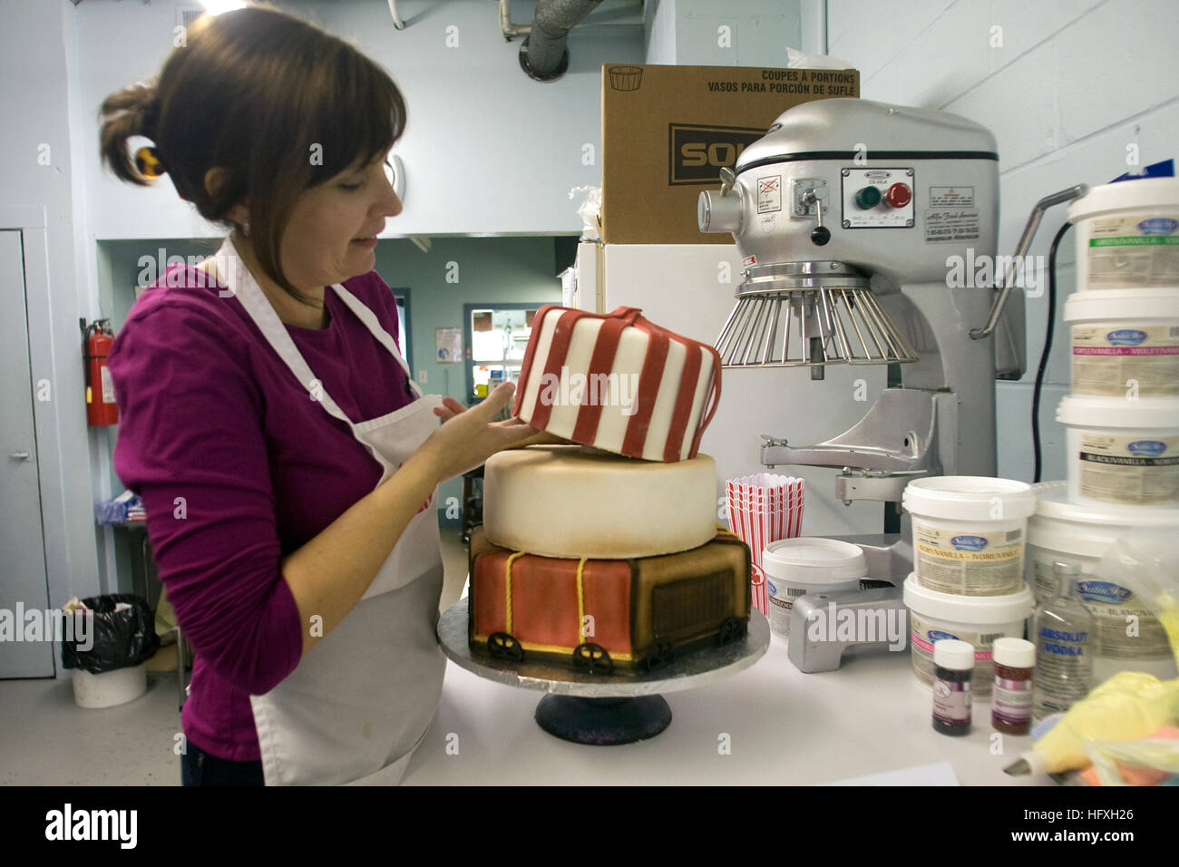 Amy Cheetham, of Melrose Bakery in London, Canada, carefully places the ...