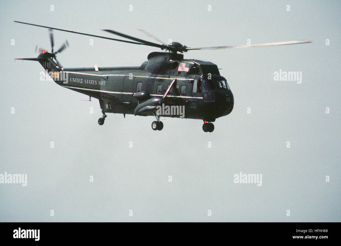 A Helicopter Combat Support Squadron 2 (HC-2) SH-3G Sea King helicopter comes in for a landing ...