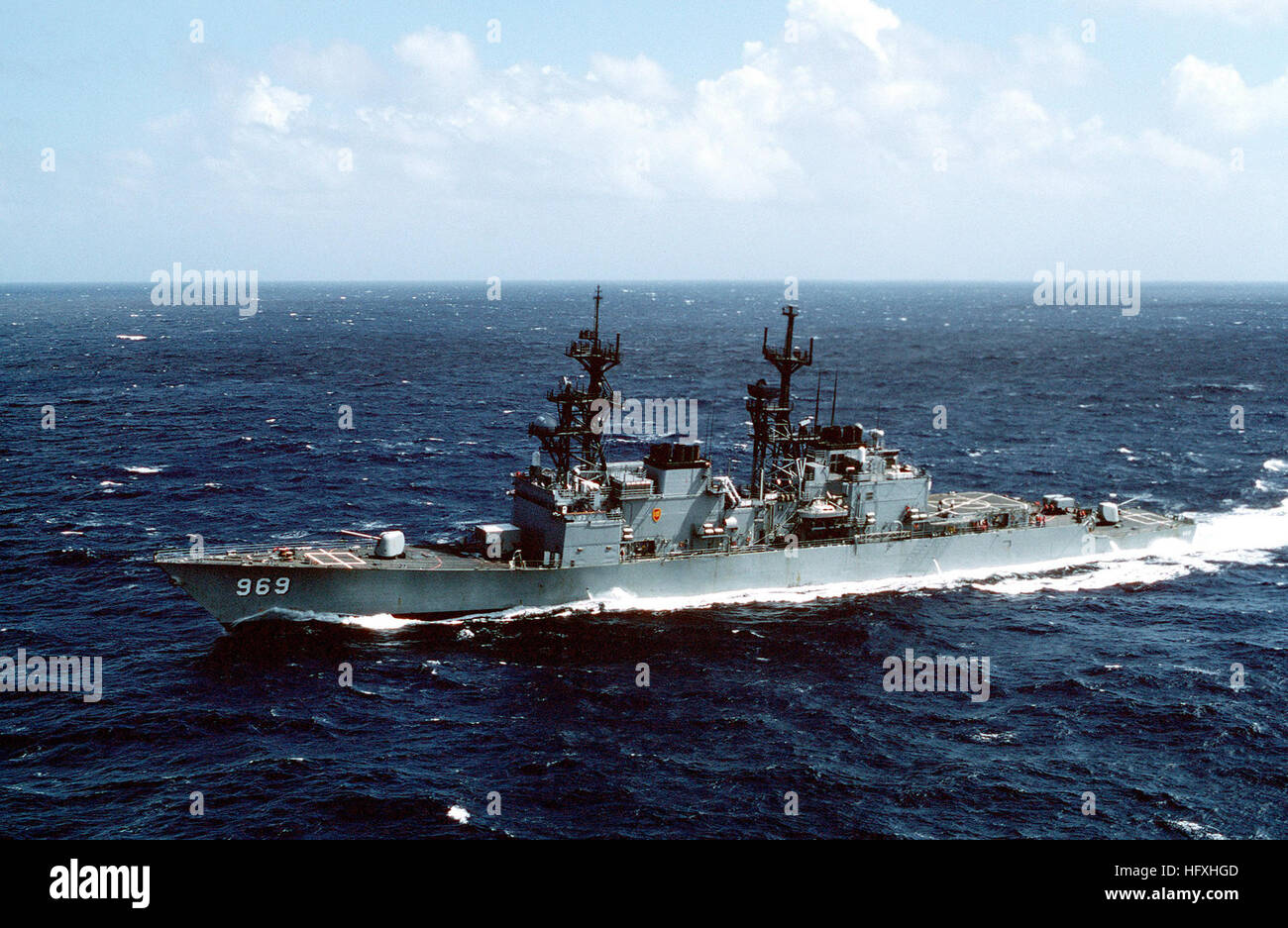 A port view of the destroyer USS PETERSON (DD-969) underway during ...