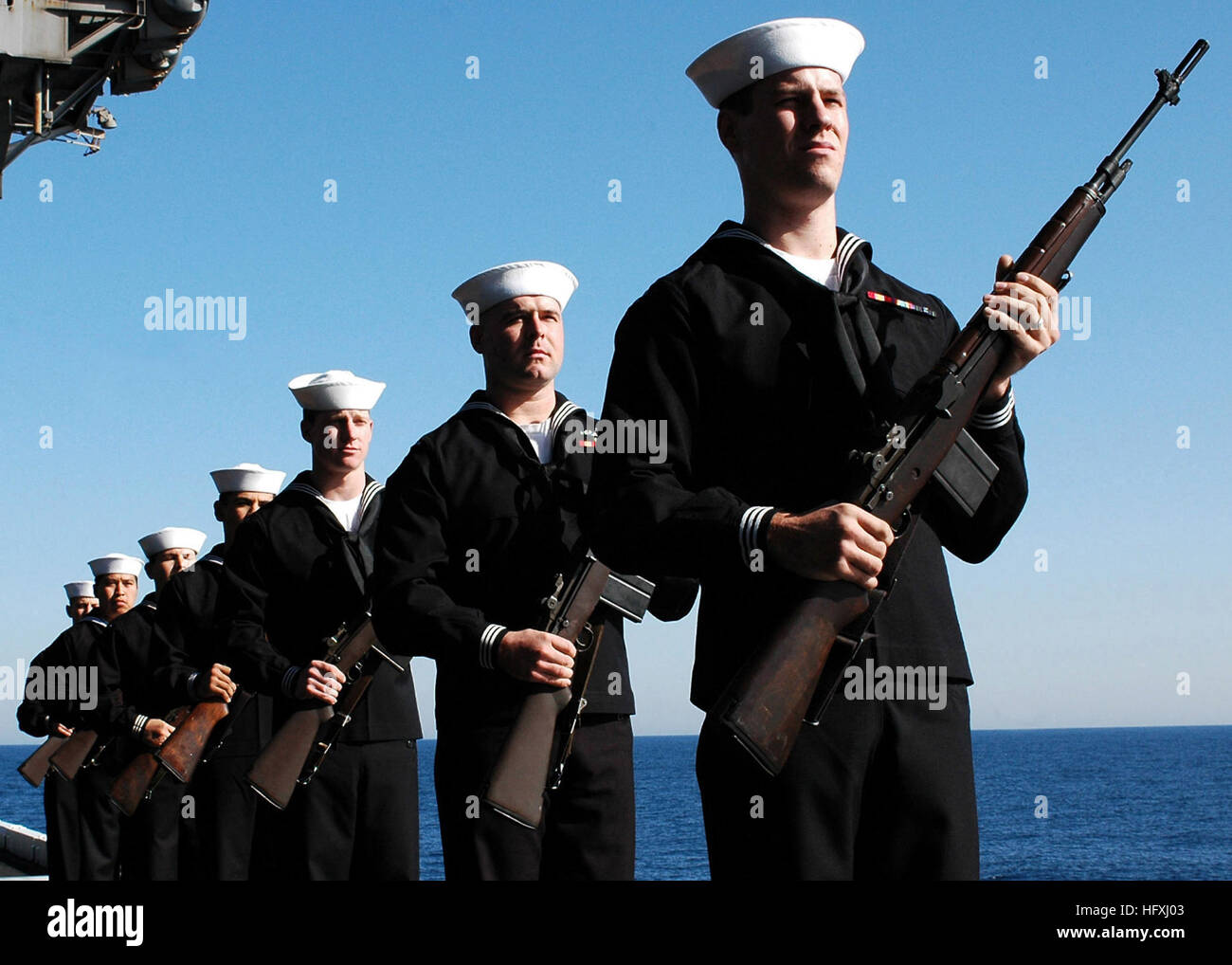 Members of a rifle team conduct a burial at sea ceremony aboard nuclear ...