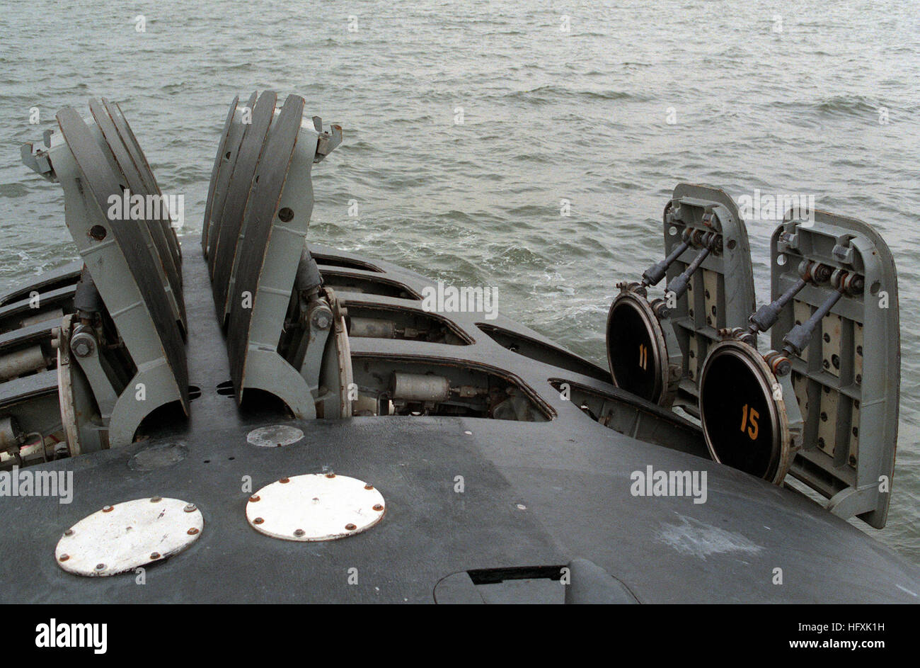 USS McCloy (FF-1038) approaches the disabled submarine USS Bonefish (SS ...