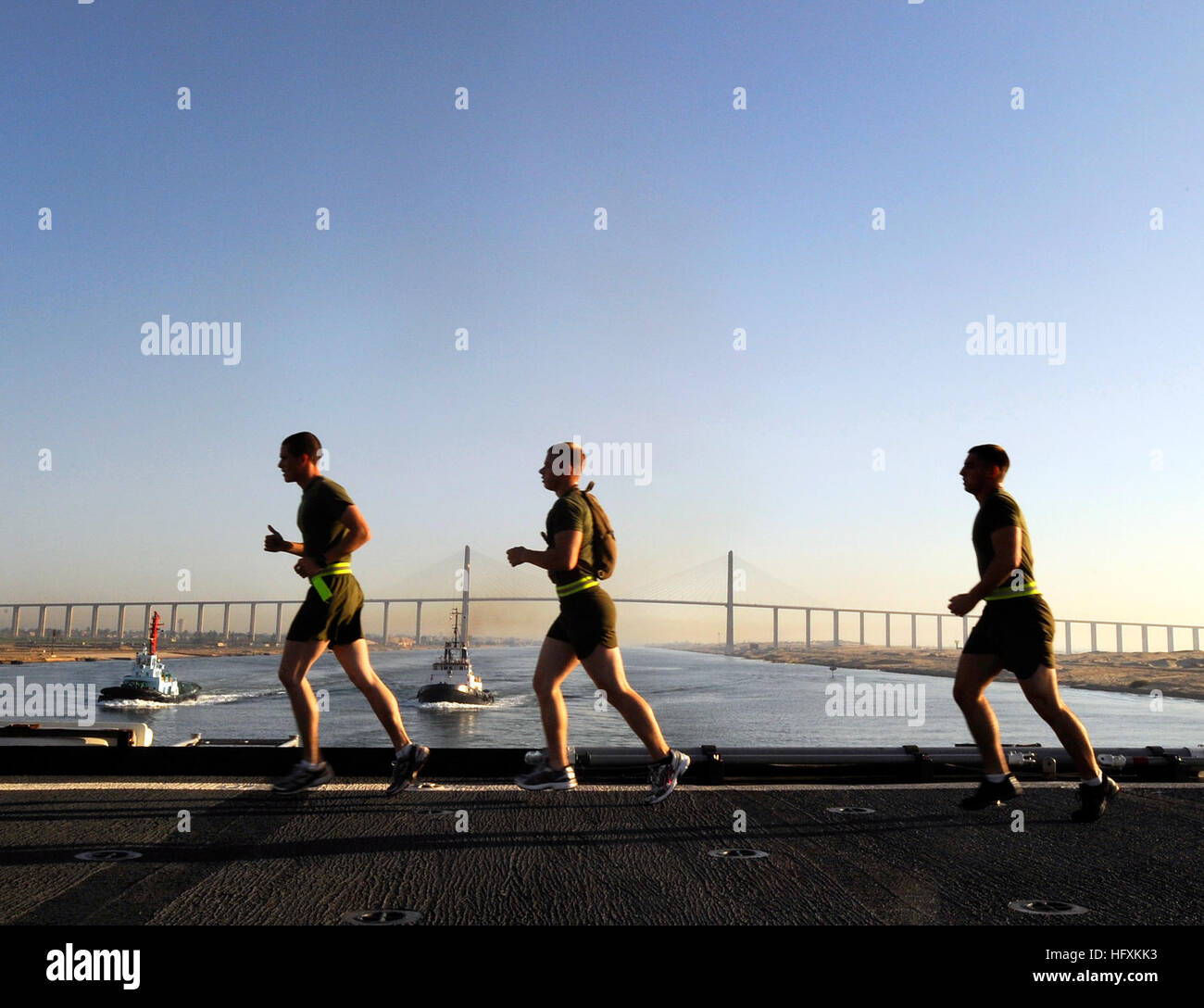 Marines assigned to the 22nd Marine Expeditionary Unit run laps on the ...