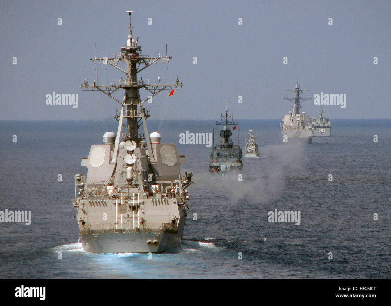USS Chafee (DDG 90) fires 5-inch gun at surface target while ...