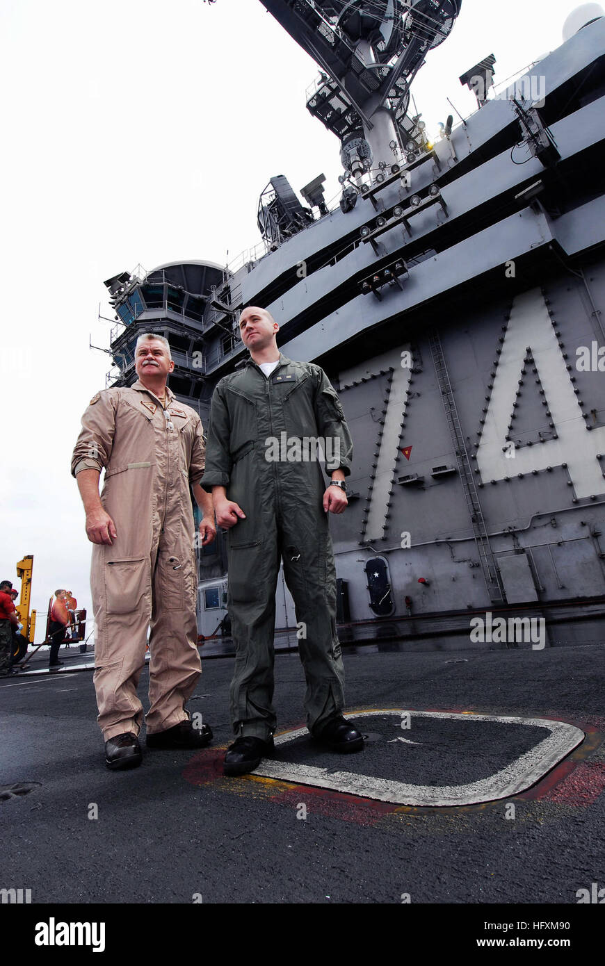 Carrier Air Wing 9 Deputy Commander and Midshipman stand on the flight ...