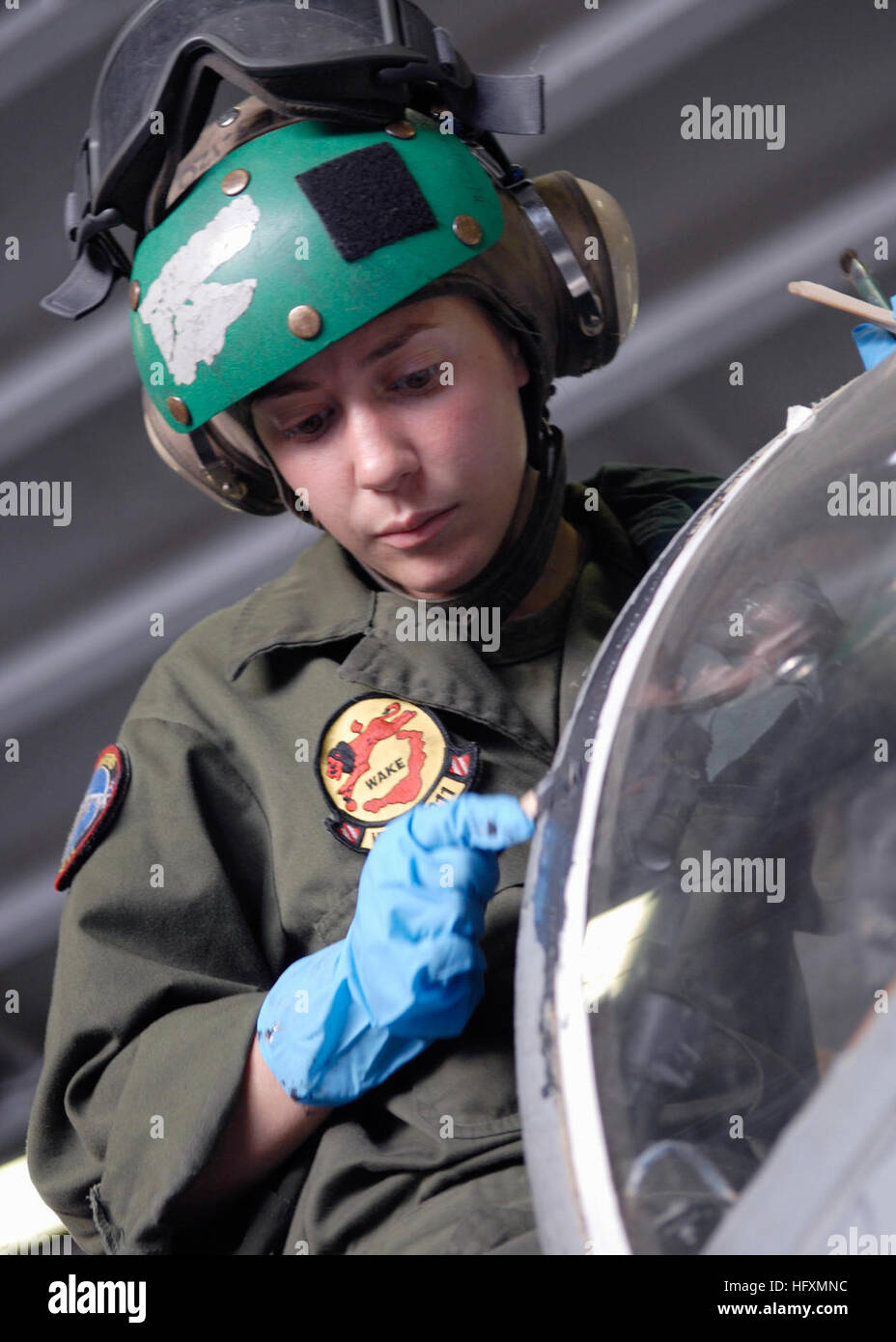 Marine Corps Cpl. applies sealant to AV-8B Harrier cockpit aboard ...