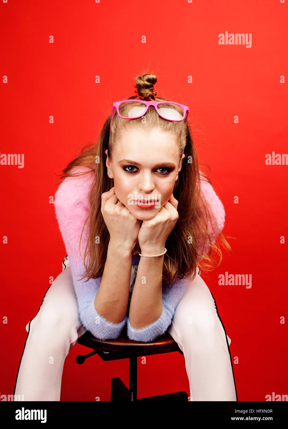 young pretty emitonal posing teenage girl on bright red background ...