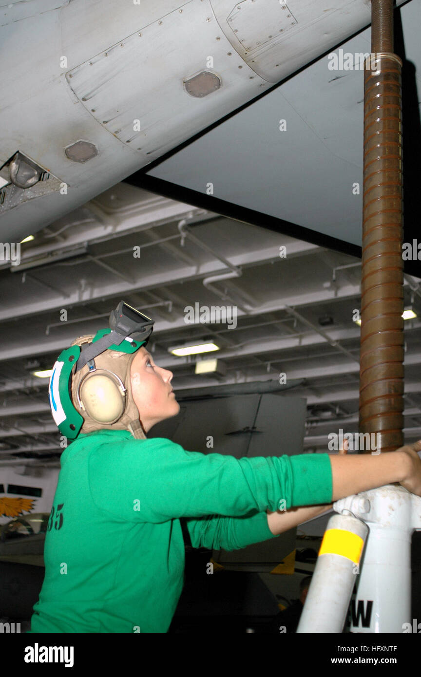 Aviation Structural Mechanic 3rd Class Katie Gibson tightens the lock ...